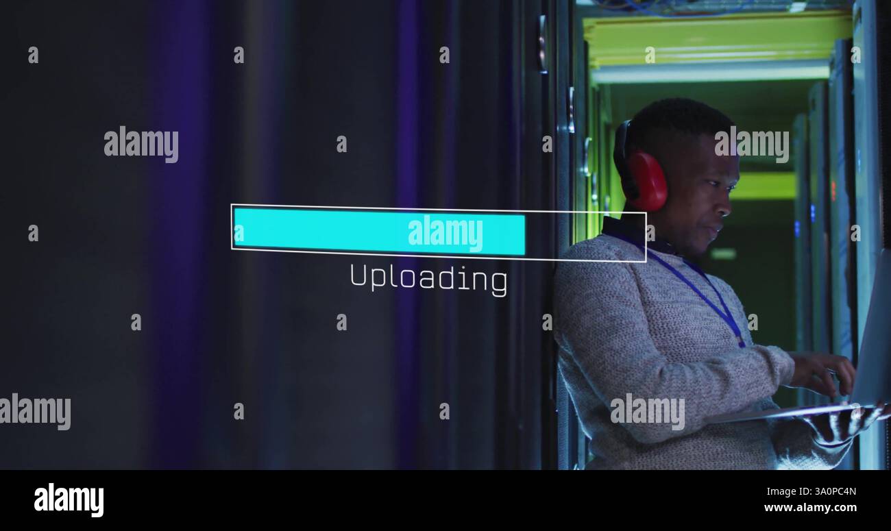Image of loading bar over african american man working in server room ...