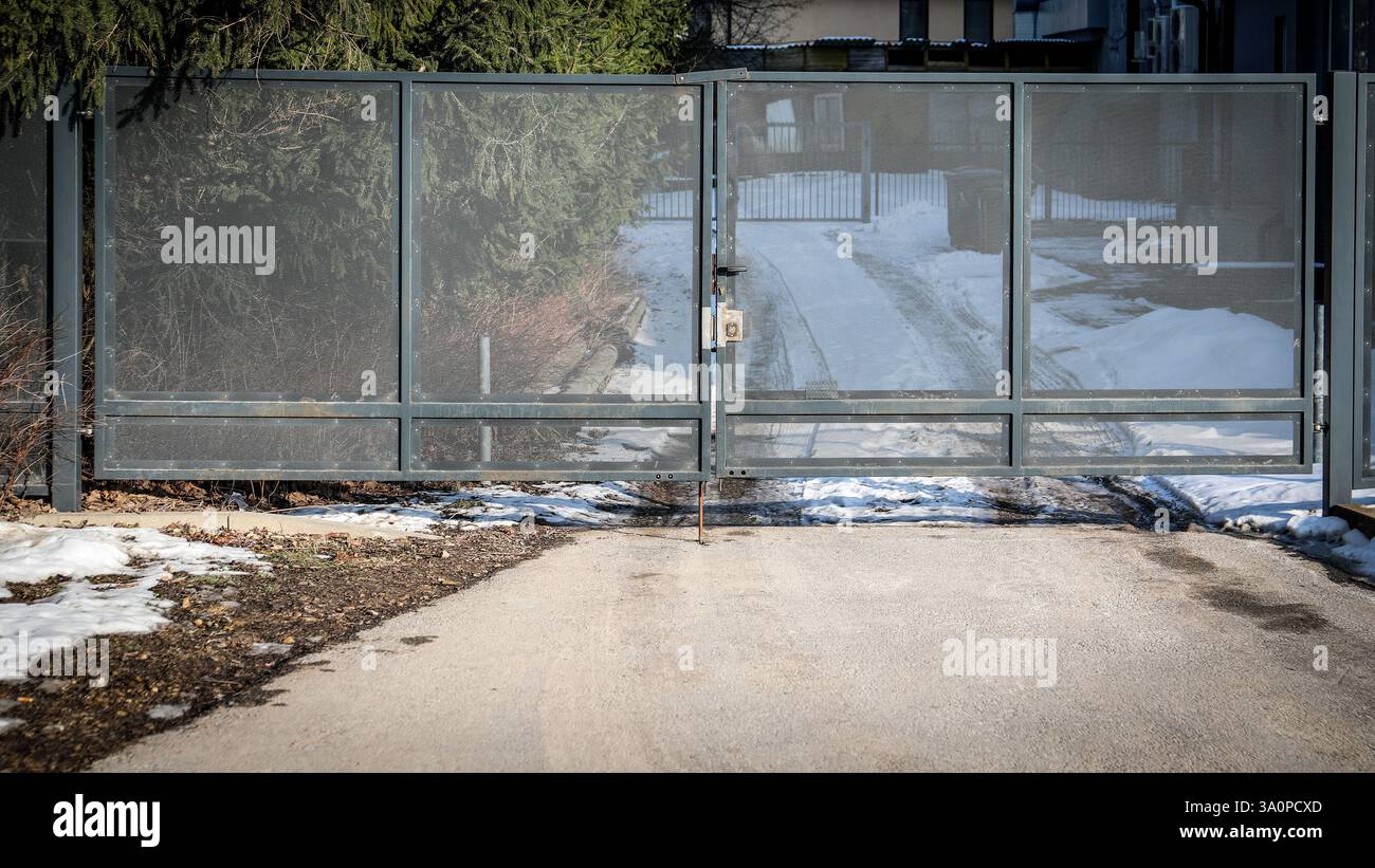 Locked territory gates. Fence in industrial zone Stock Photo - Alamy