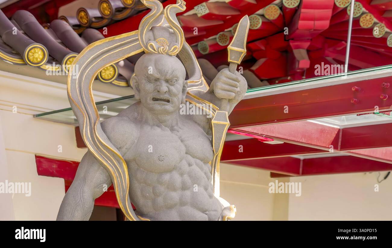 Dvarapala, a gate guardian statue, at buddha tooth relic temple Stock ...
