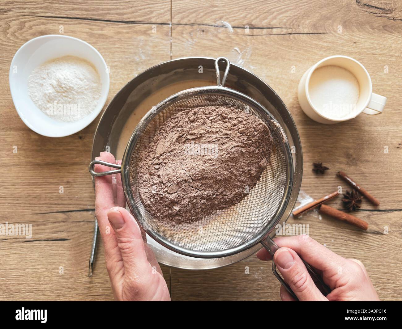 Sifting cocoa powder sieve bakery hi-res stock photography and images ...