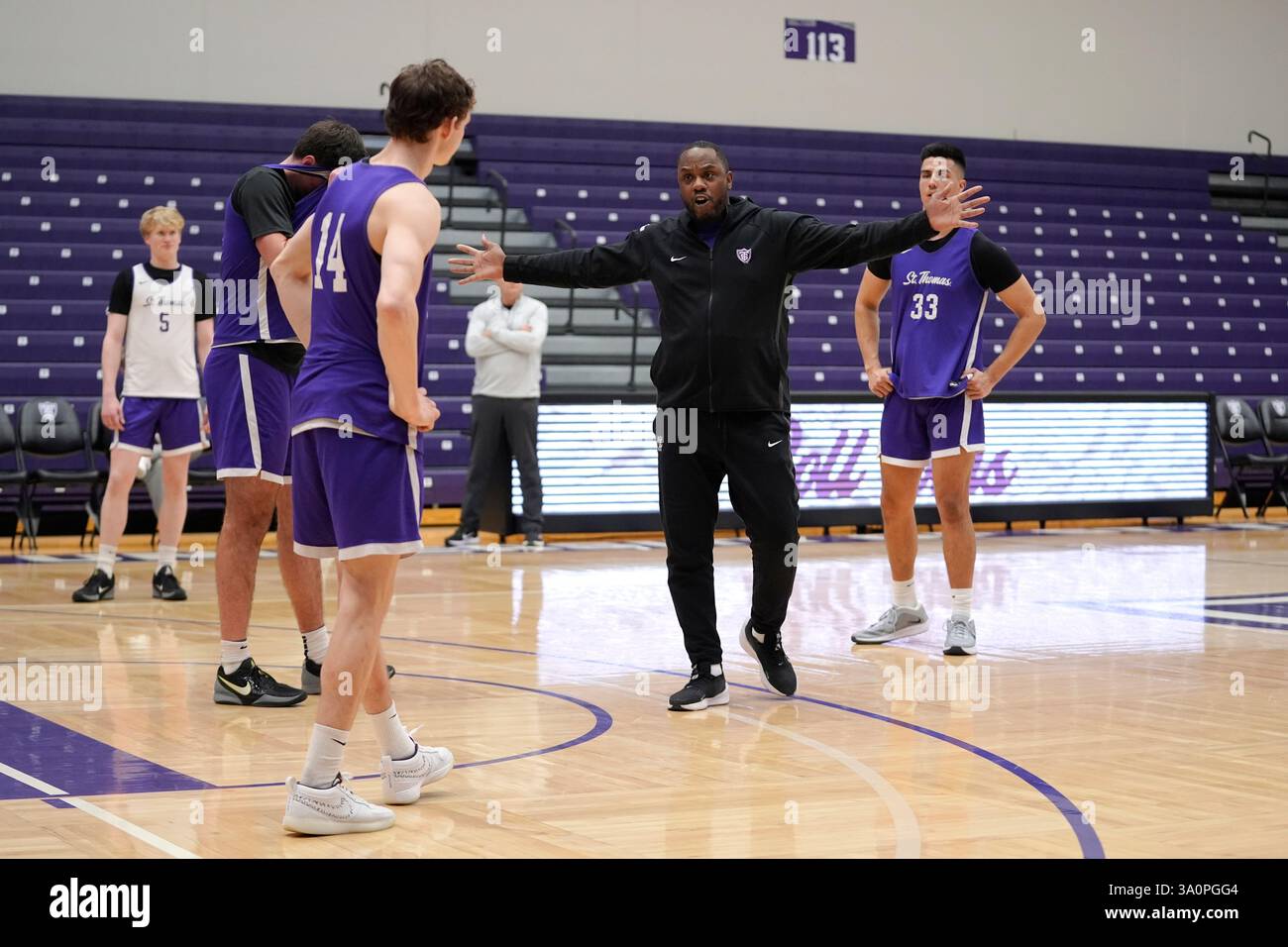 St. Thomas assistant coach Kenneth Lowe, center, gives directions ...