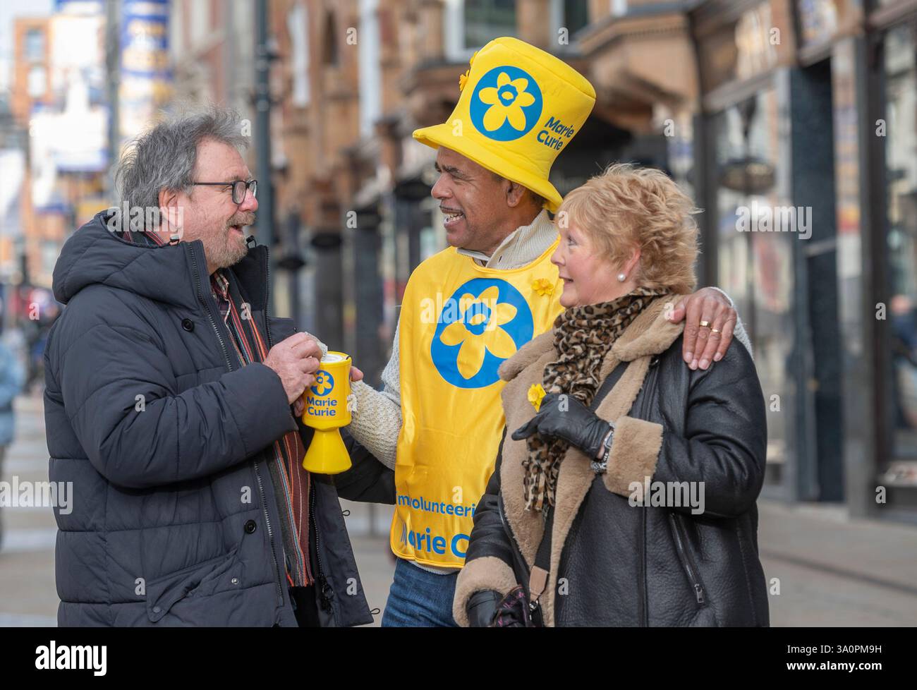 EDITORIAL USE ONLY Dennis and Anne Woods give a donation to football ...