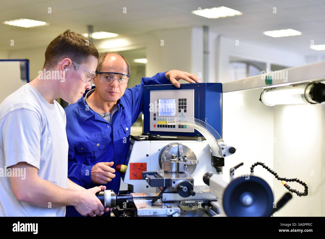 young apprentices in technical vocational training are taught by older ...