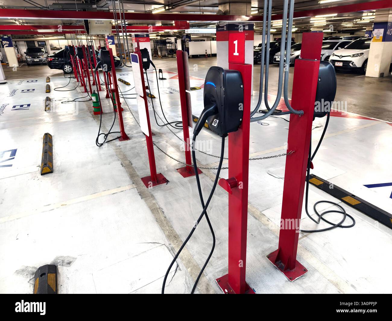 Modern EV charging station in a well lit parking showing all available ...
