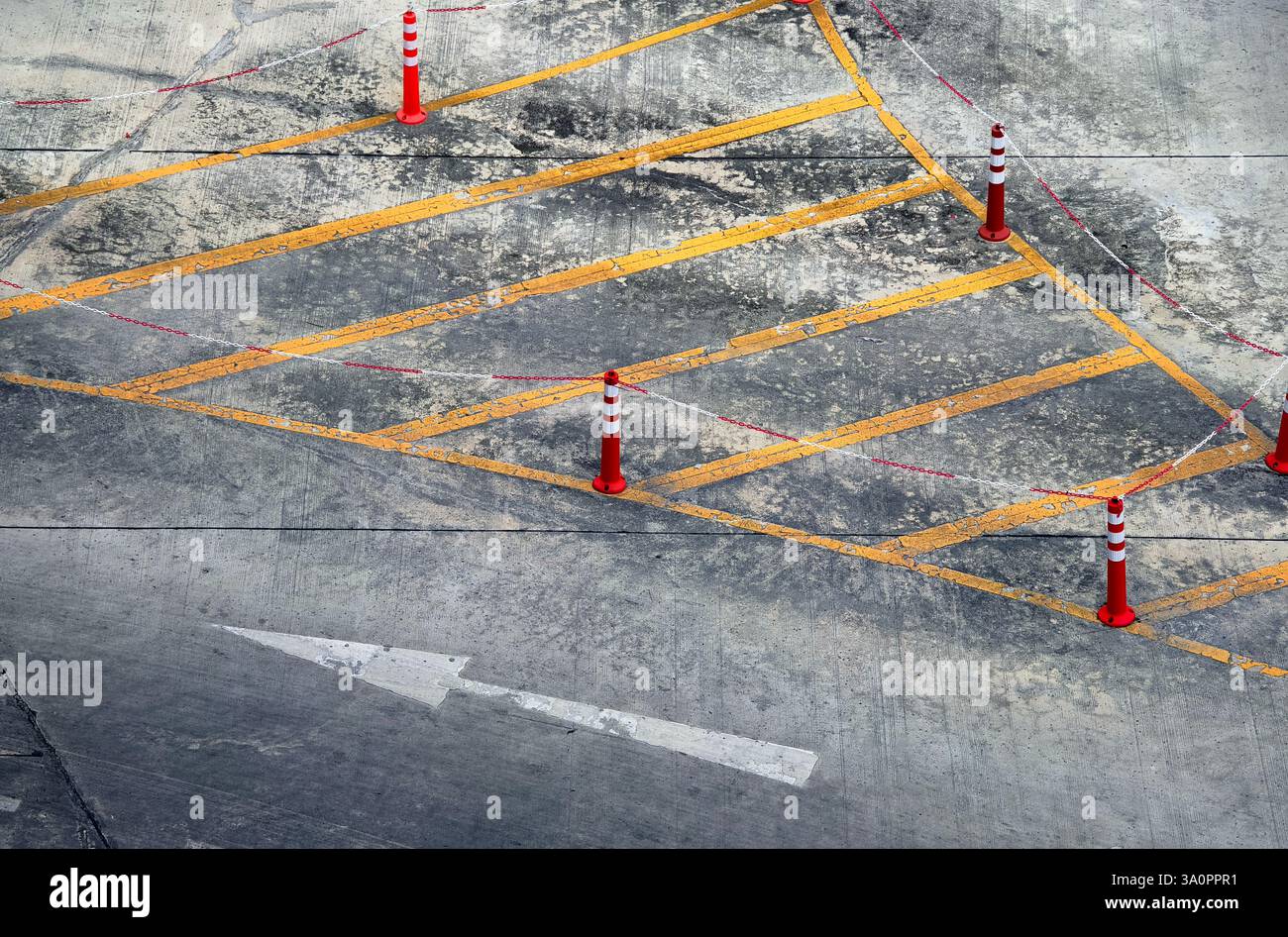 Expansive aerial view capturing a parking lot with arrows guiding ...