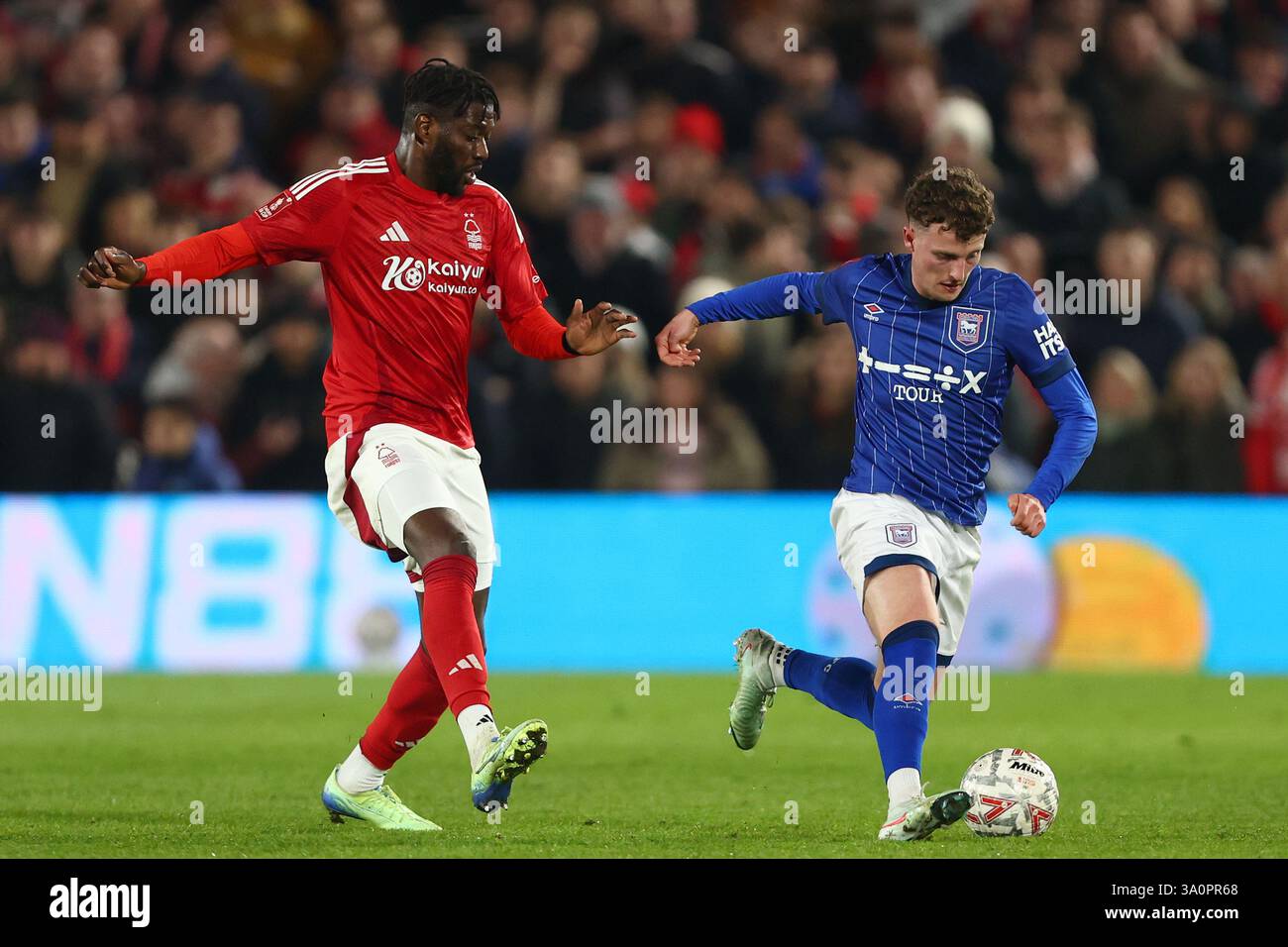 Nathan Broadhead of Ipswich Town and Ibrahim Sangare of Nottingham ...