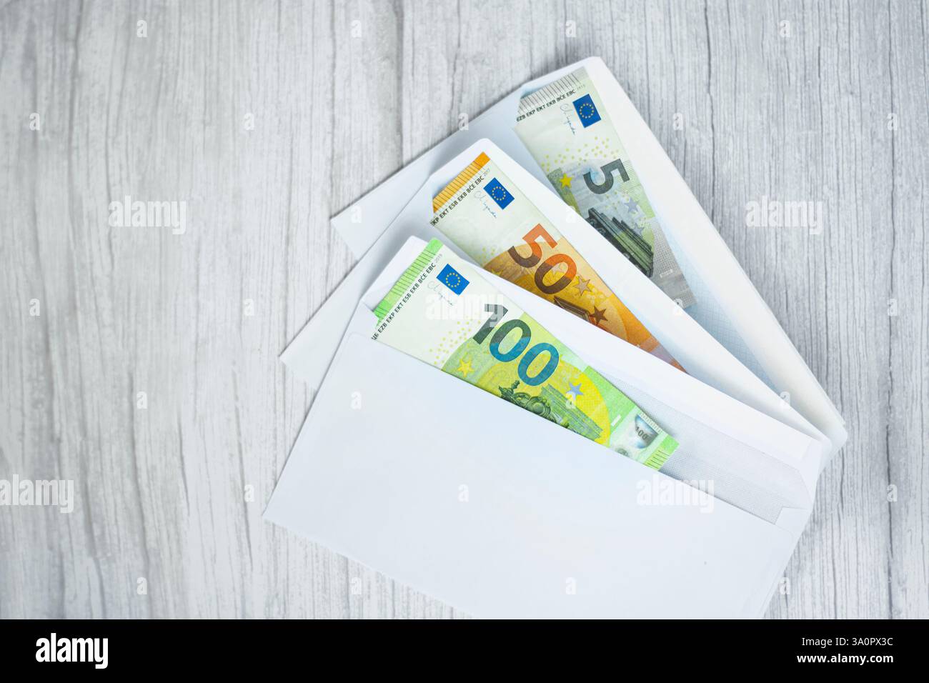 Various Euro paper banknotes in separate envelopes Stock Photo - Alamy