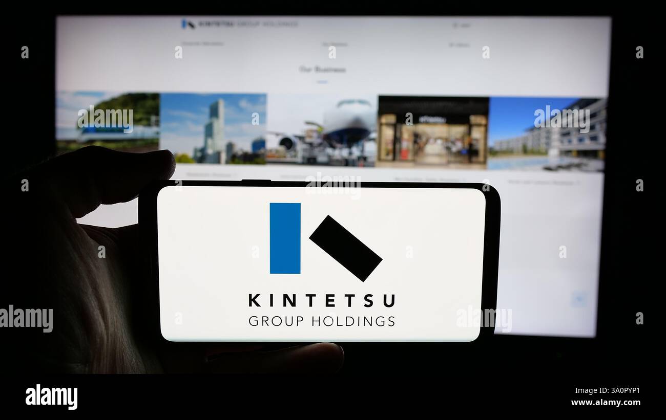 Germany. 3rd Dec, 2024. In this photo illustration, a person is holding a cellphone with the ...