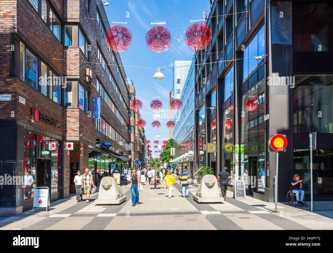 People go shopping in the Drottninggatan (Queen Street) in Stockholm ...