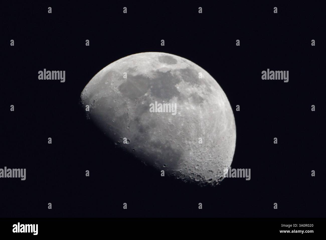 Photo of the Moon in a waxing gibbous half moon phase Stock Photo - Alamy