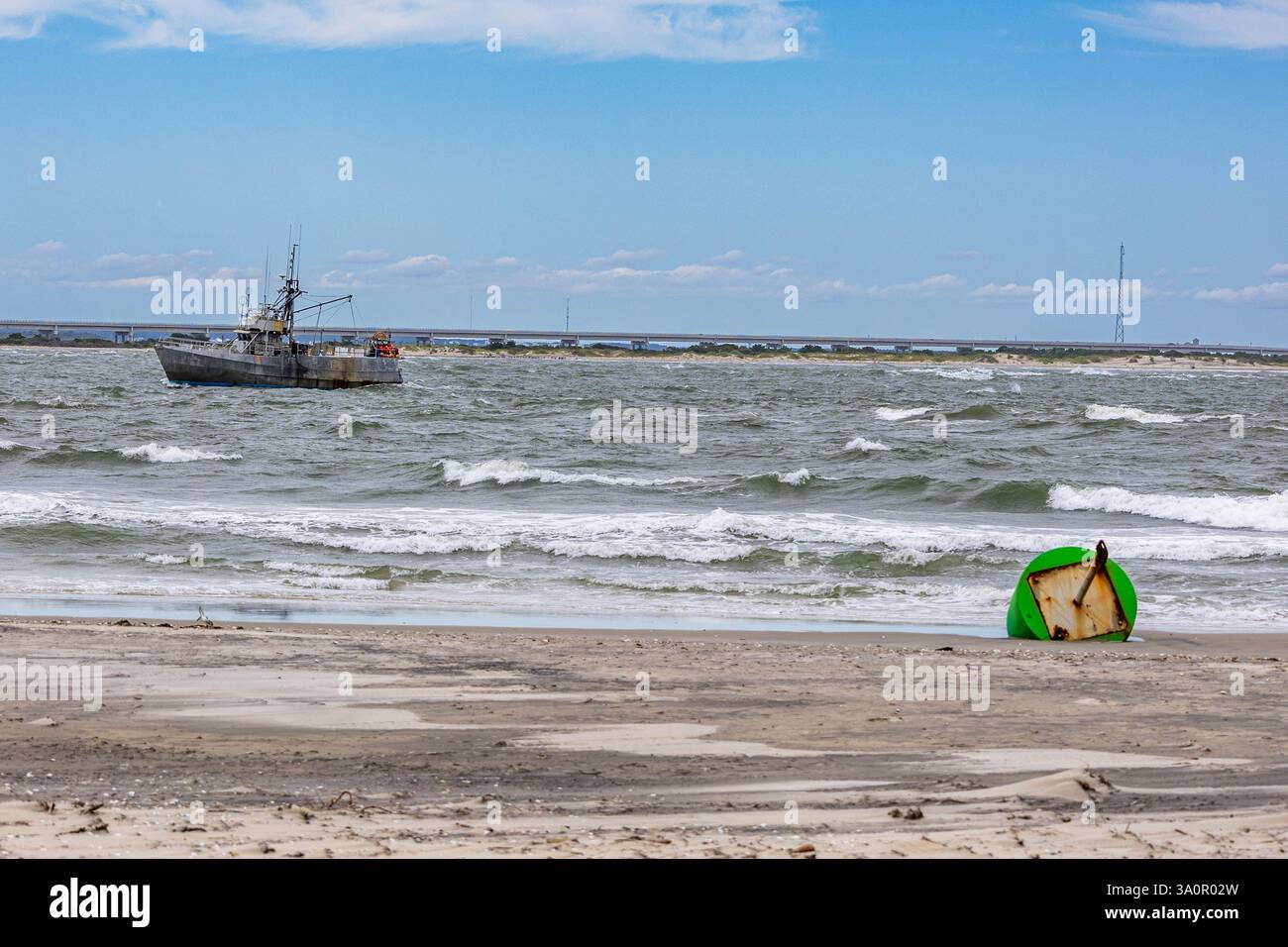 Ship passing a buoy inbound on the way past Oregon Inlet in Nags Head ...