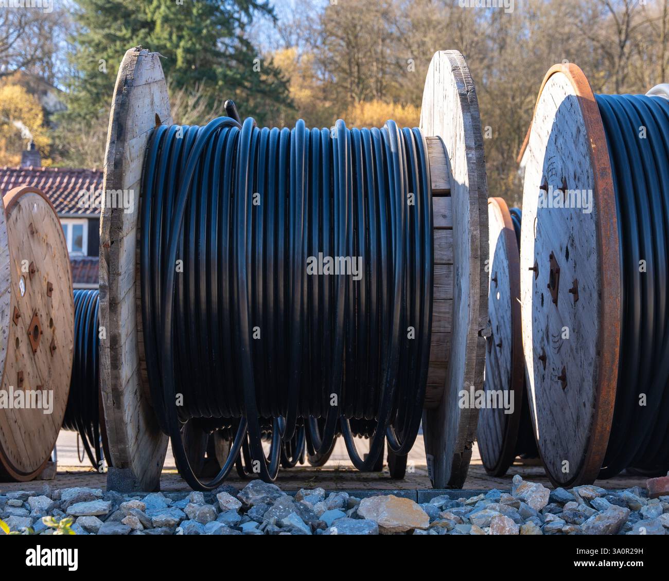Large industrial reels with electrical cables are located at a ...