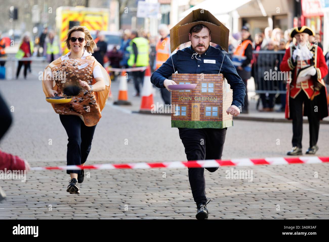 The annual Shrove Tuesday Pancake race being held in Lichfield, Staffordshire. Pictured, Jack ...