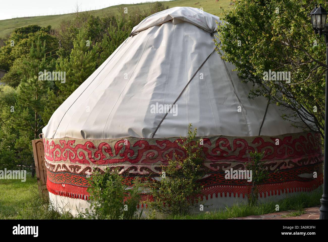 In the photo, there is a yurt, a traditional dwelling of the nomadic ...