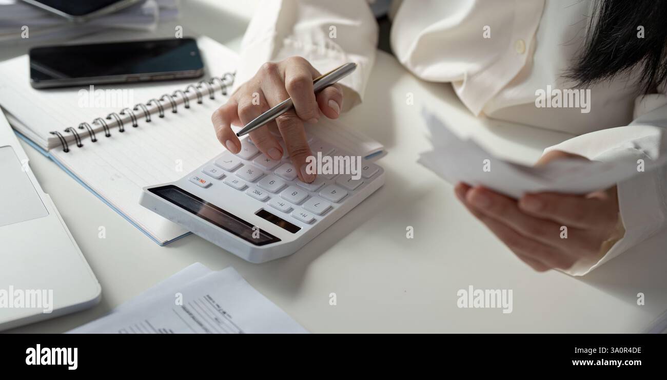 Tax Analysis. An individual conducting financial calculations and ...