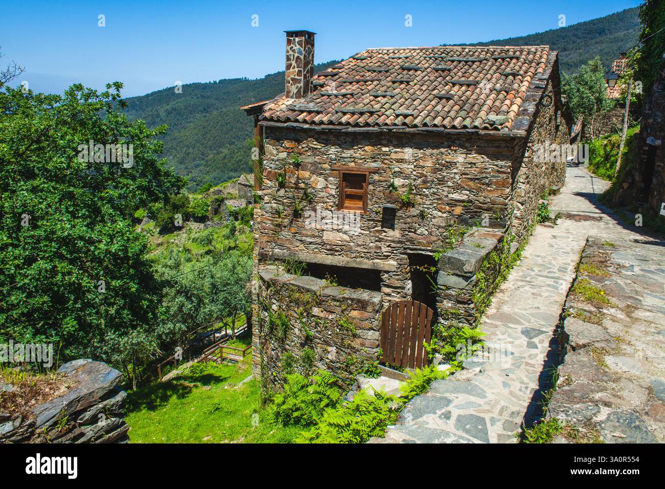 View on an old street of flagstone house Stock Photo - Alamy