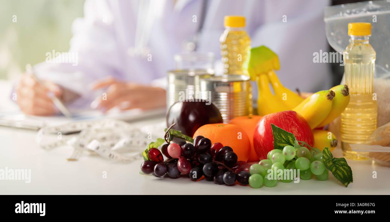 Nutrition and health. A nutritionist analyzing food options with fresh ...