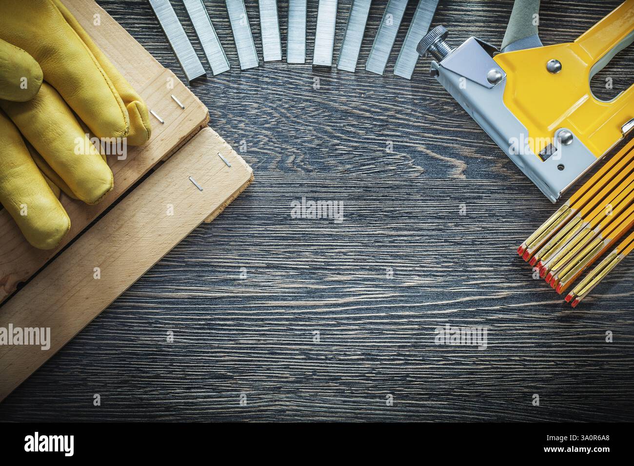 Construction stapler staples wooden metre planks leather safety gloves ...