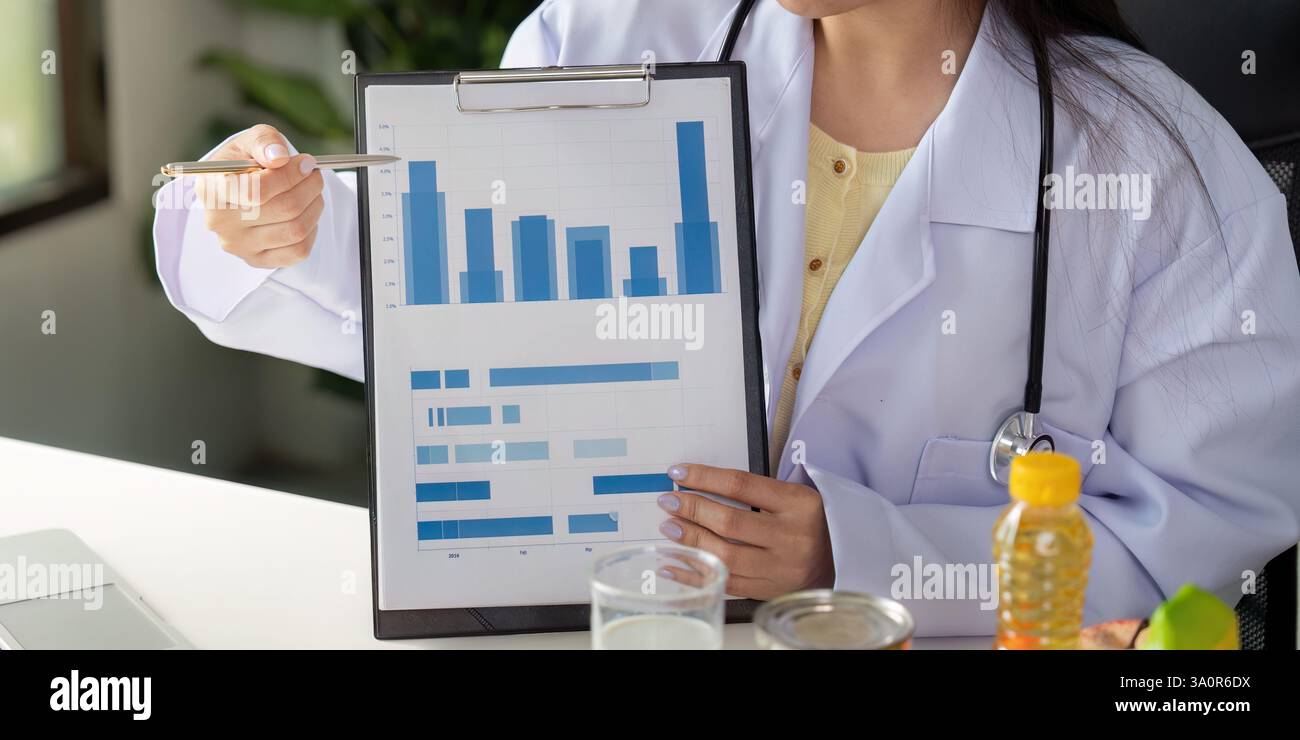 Nutrition analysis. A dietitian explaining data on food consumption ...