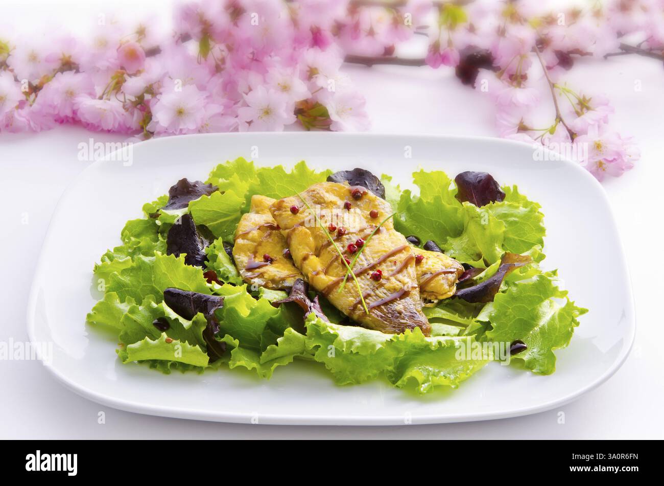 Roasted one fish with balsamic cream ones Stock Photo - Alamy