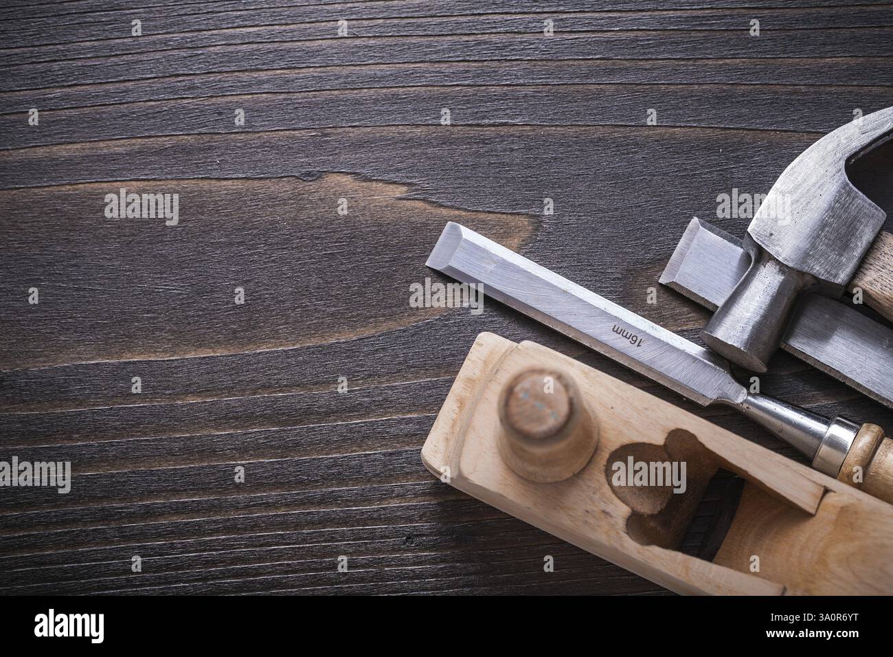 Copy space image of claw hammer planer and firmer chisels on vintage ...