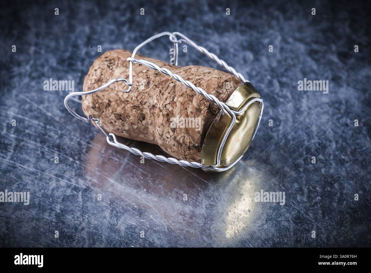 Champagne cork plugs twisted wire on metallic background alcohol ...