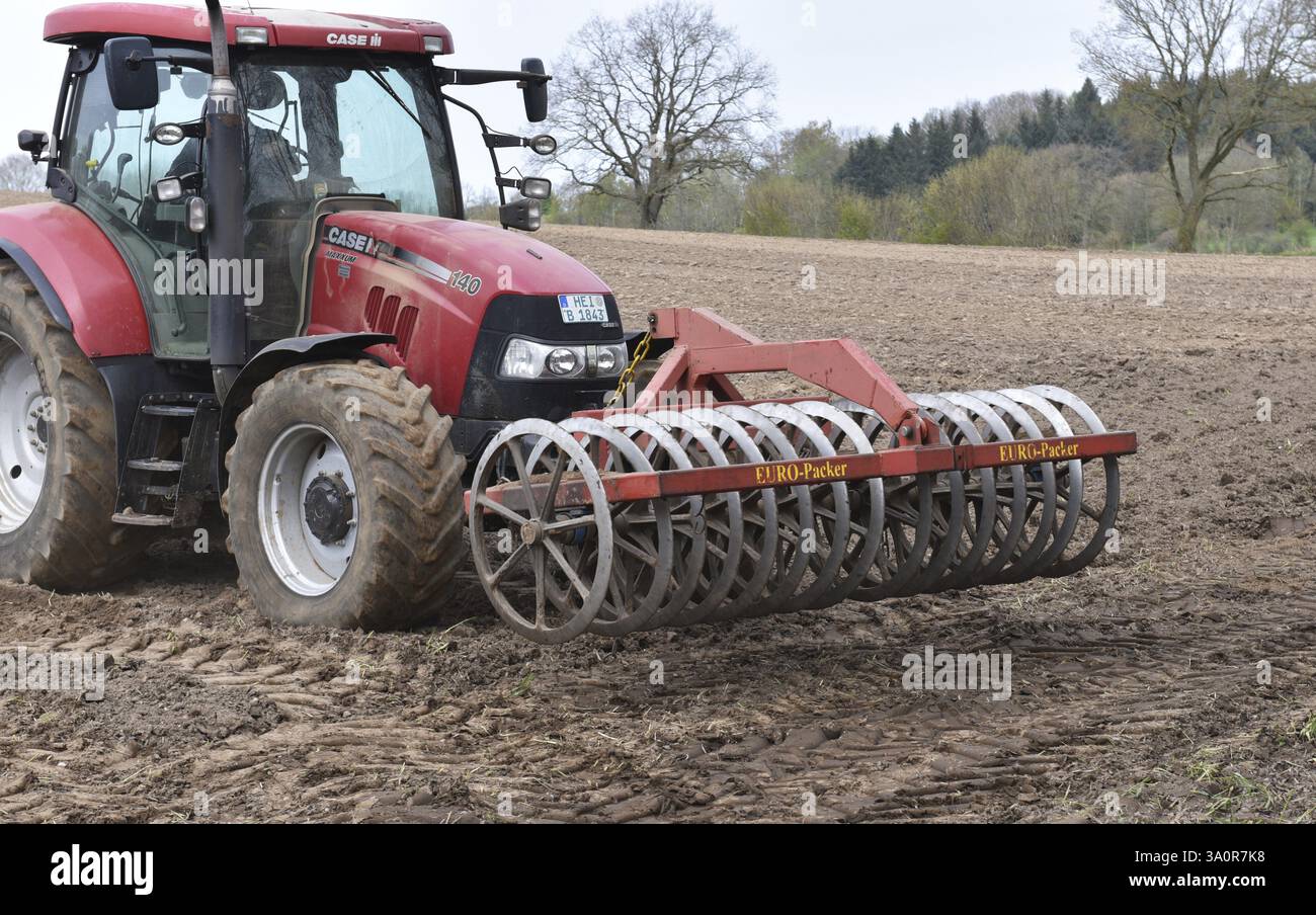 Tractor with front implement in the field Stock Photo - Alamy