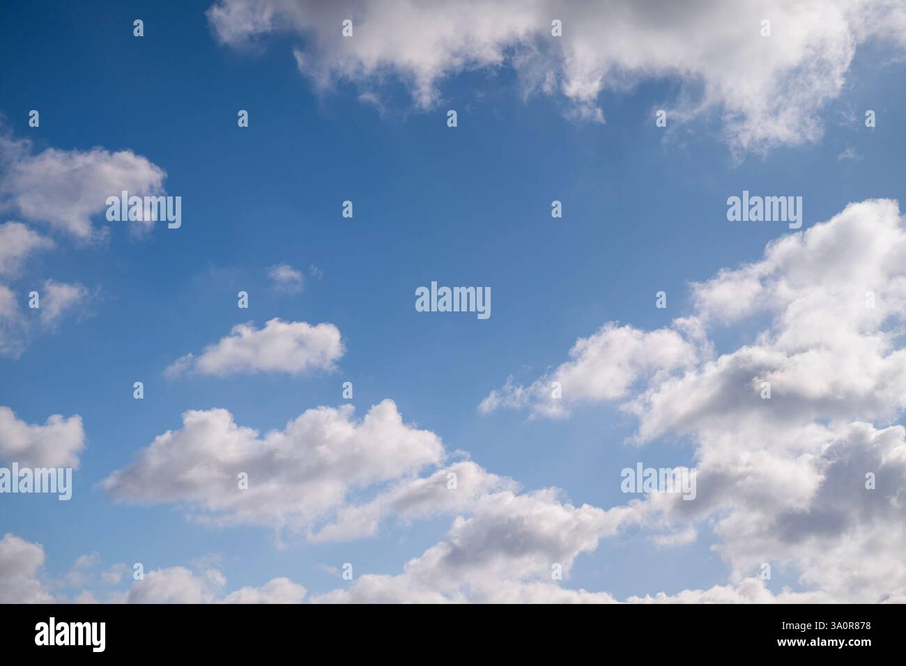 Blue 'Simpsons Sky' - clear blue sky with white fluffy clouds Stock ...