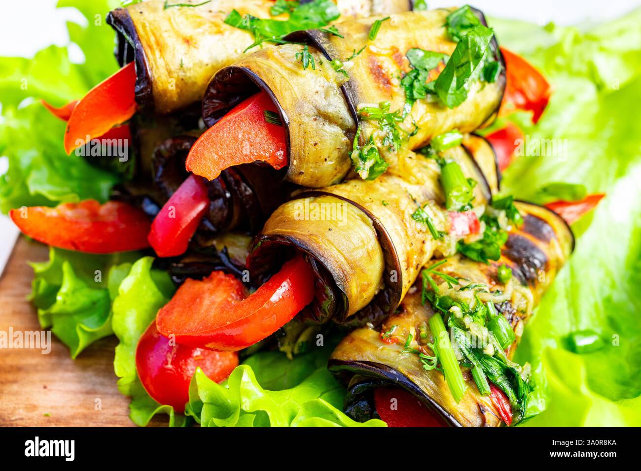 Colorful grilled vegetable rolls are arranged beautifully on fresh ...