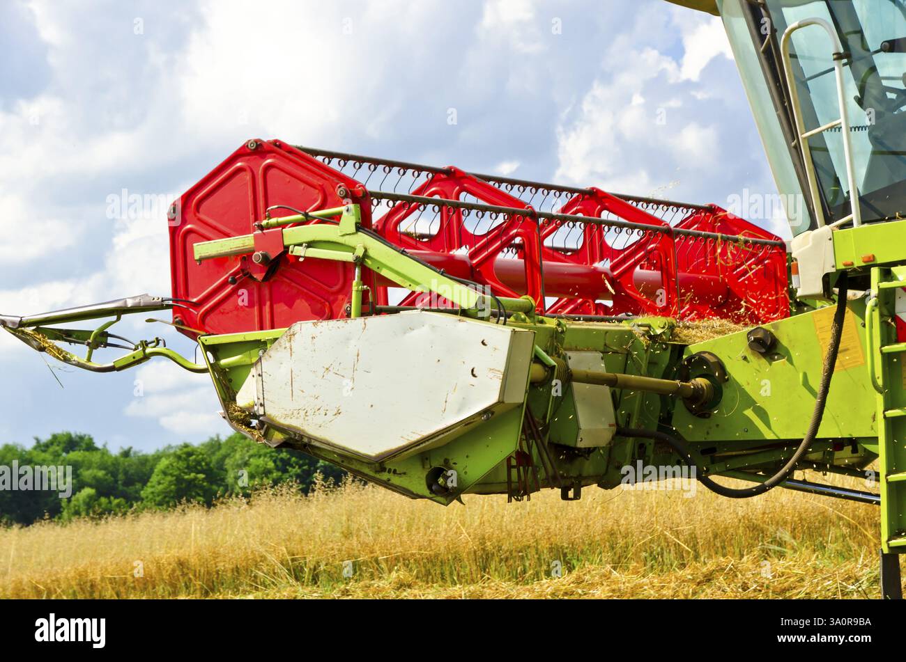 Combine working in field harvesting hi-res stock photography and images ...