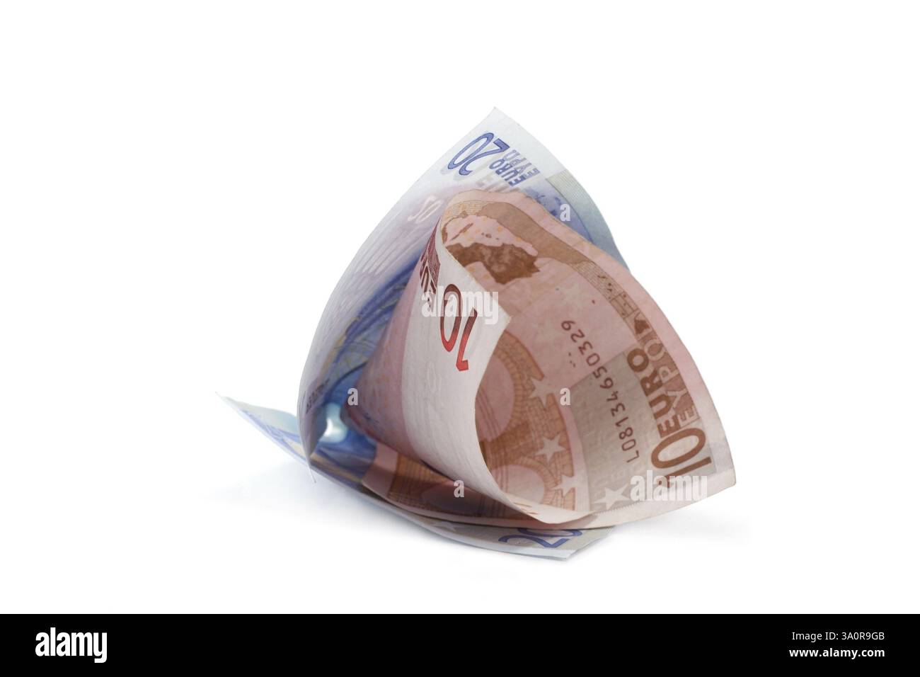 Bills euro rolled up insulated on white background Stock Photo - Alamy