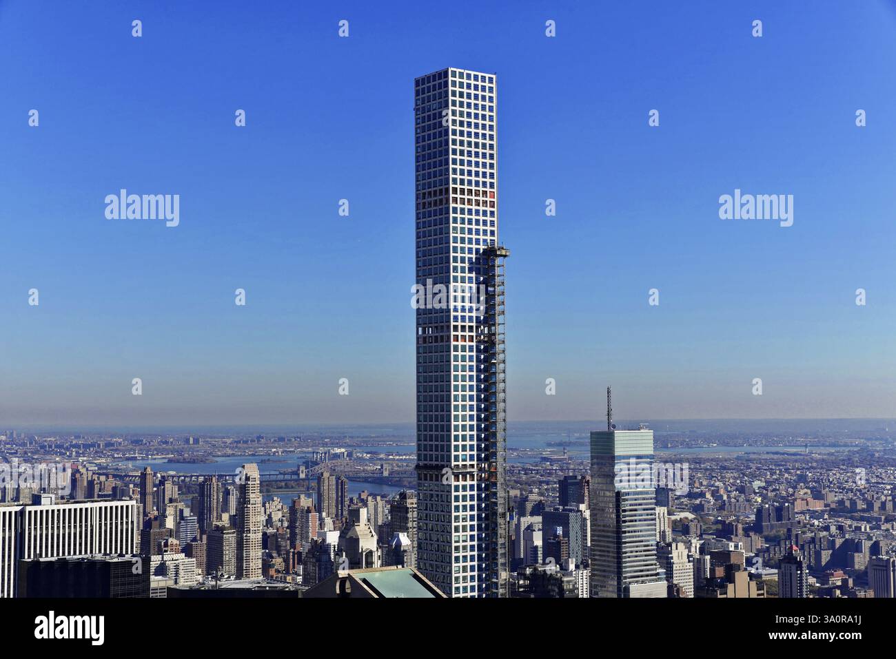 Rockefeller Center observation deck, A sleek, modern skyscraper rises ...