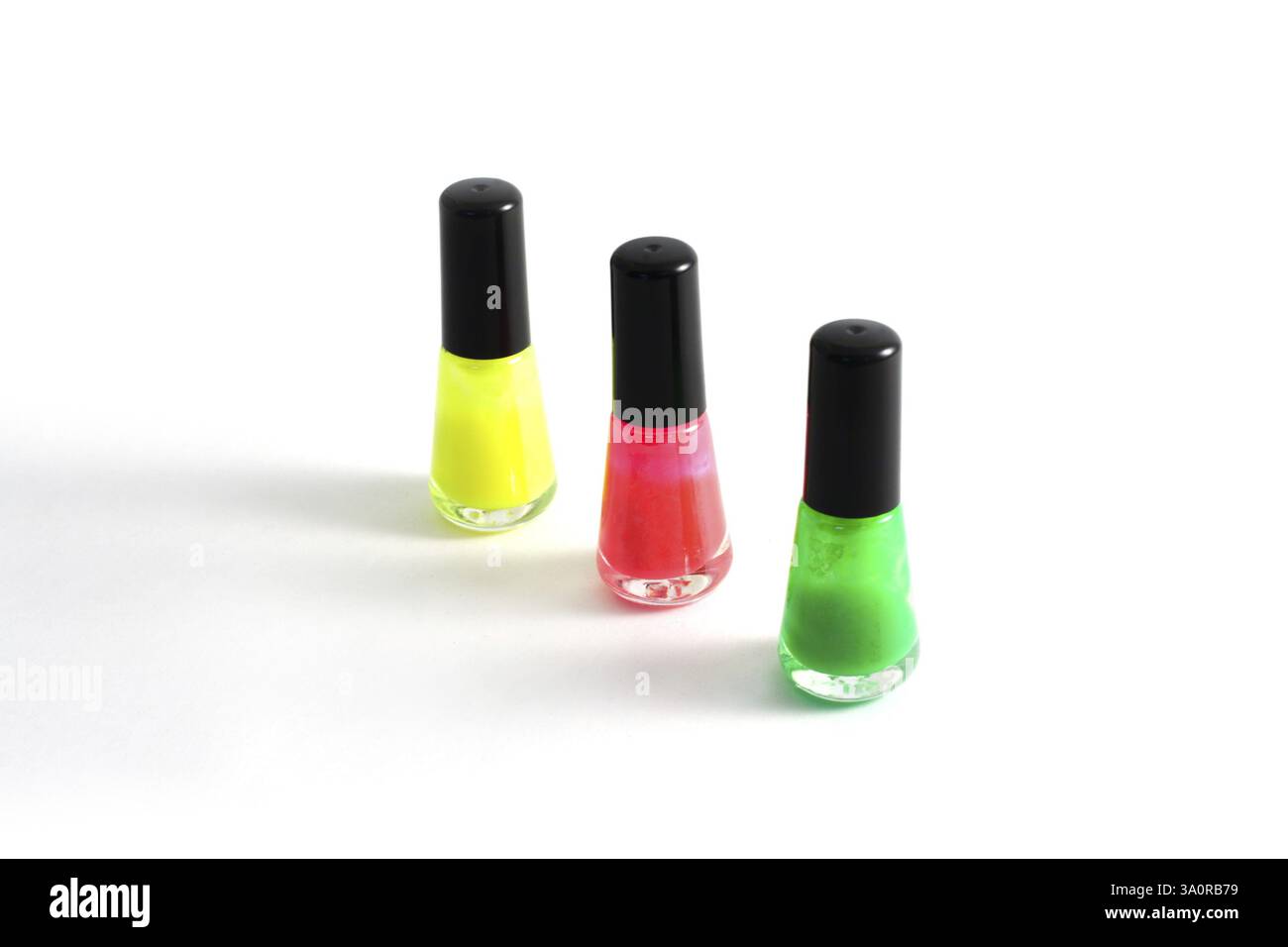 Three vials of the colour varnish for nail on white background Stock ...