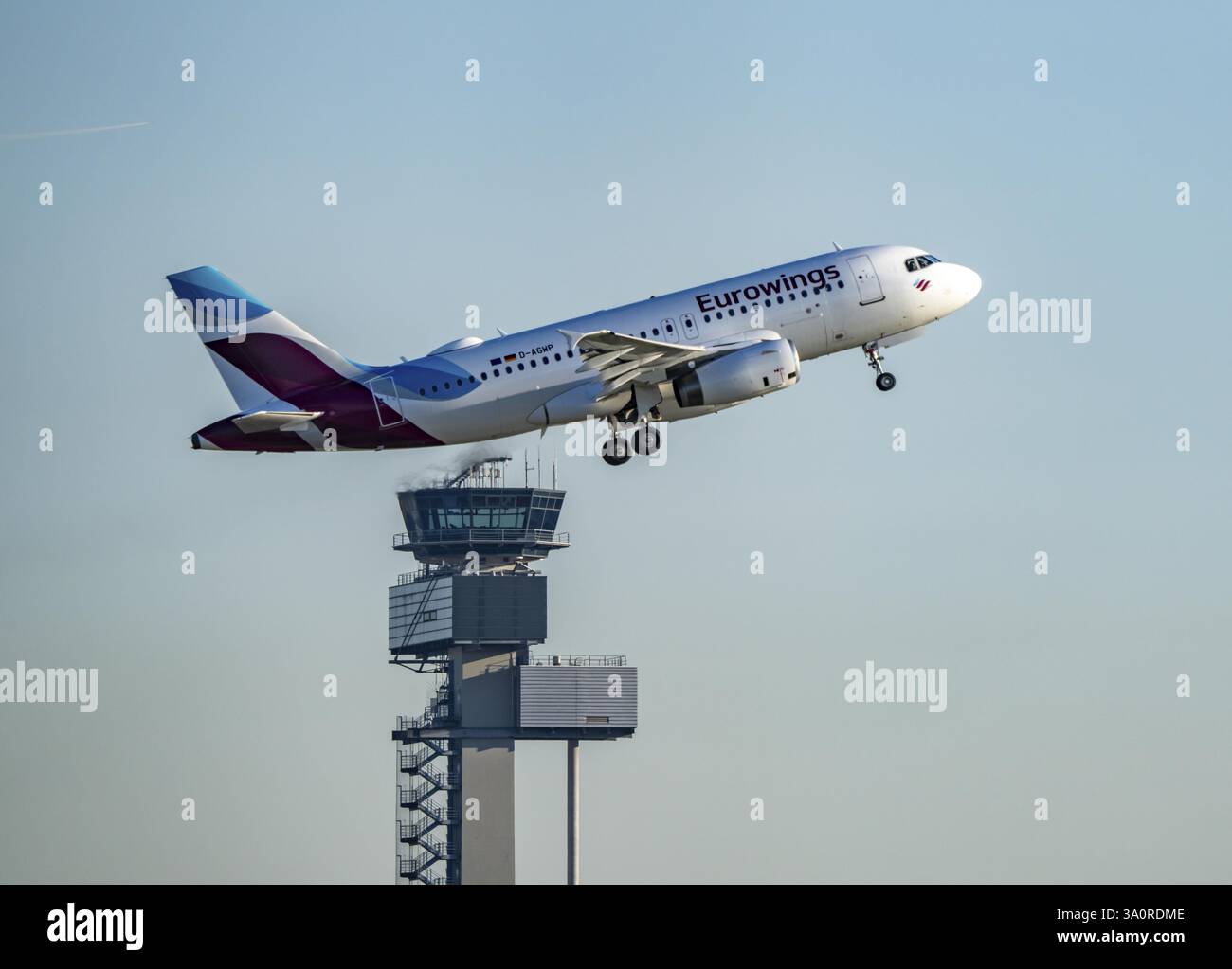 Eurowings Airbus A319 aircraft taking off on the main runway south, 05R ...