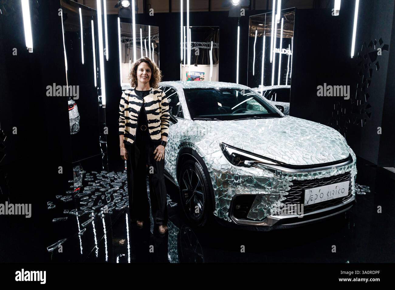 The director of Lexus Spain, Mar Pieltain, poses with the Lexus LBX ...