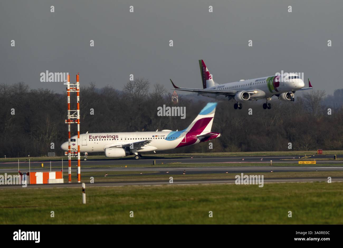 AP Air Portugal Express aircraft landing on the main runway south, 05R ...