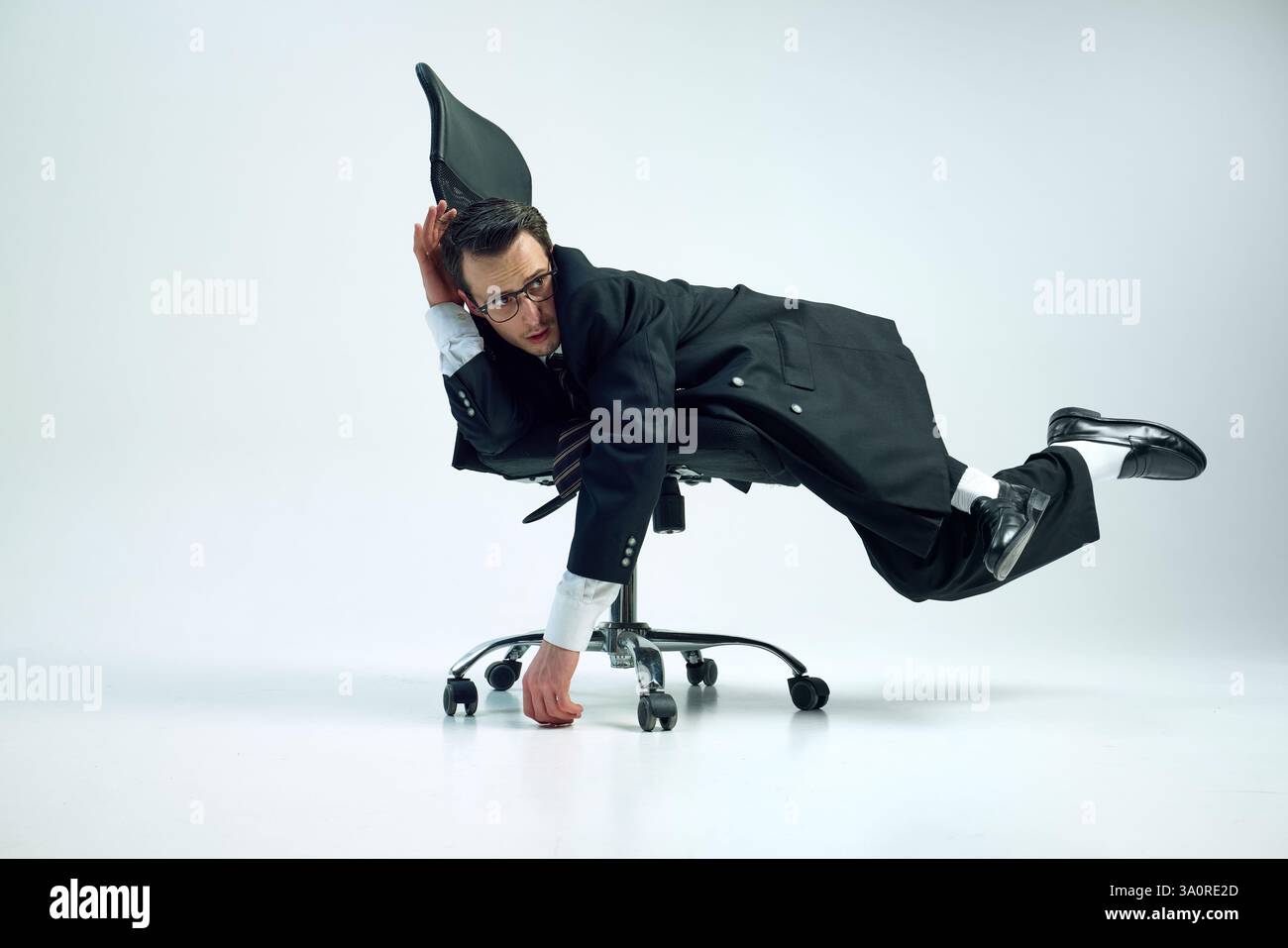 Leader extending lying on office chair in visual metaphor for workplace ...