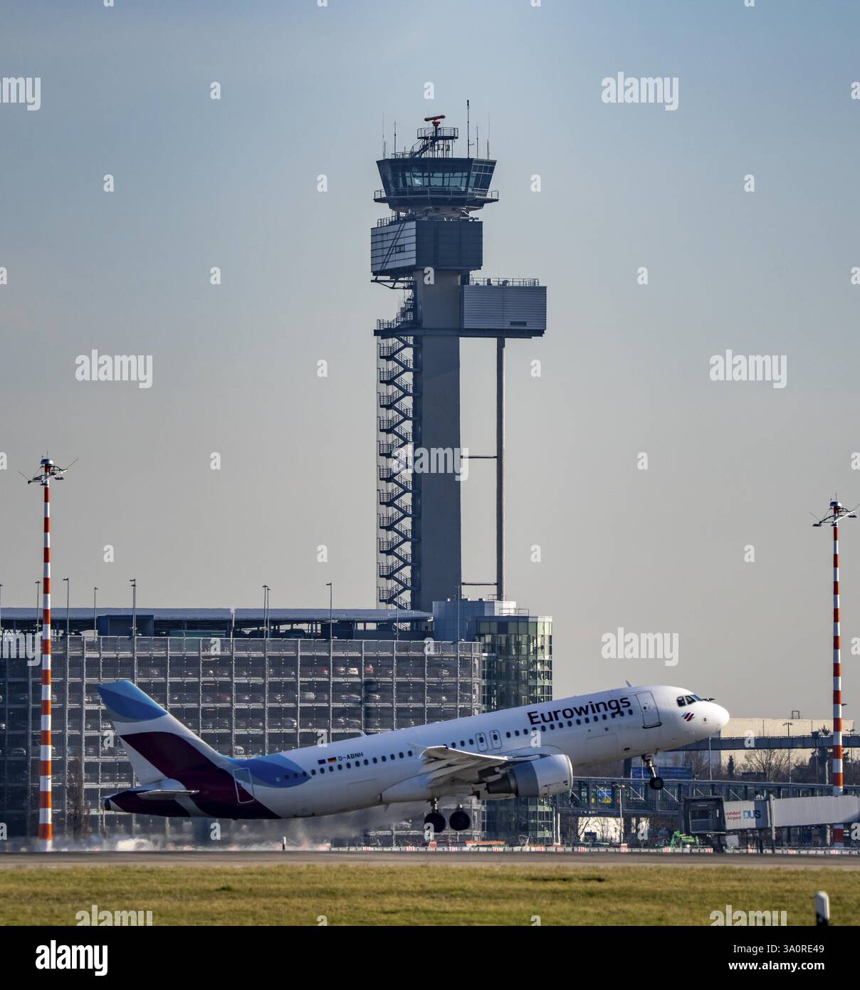 Eurowings Airbus A320 aircraft taking off on the main runway south, 05R/23L, Duesseldorf ...