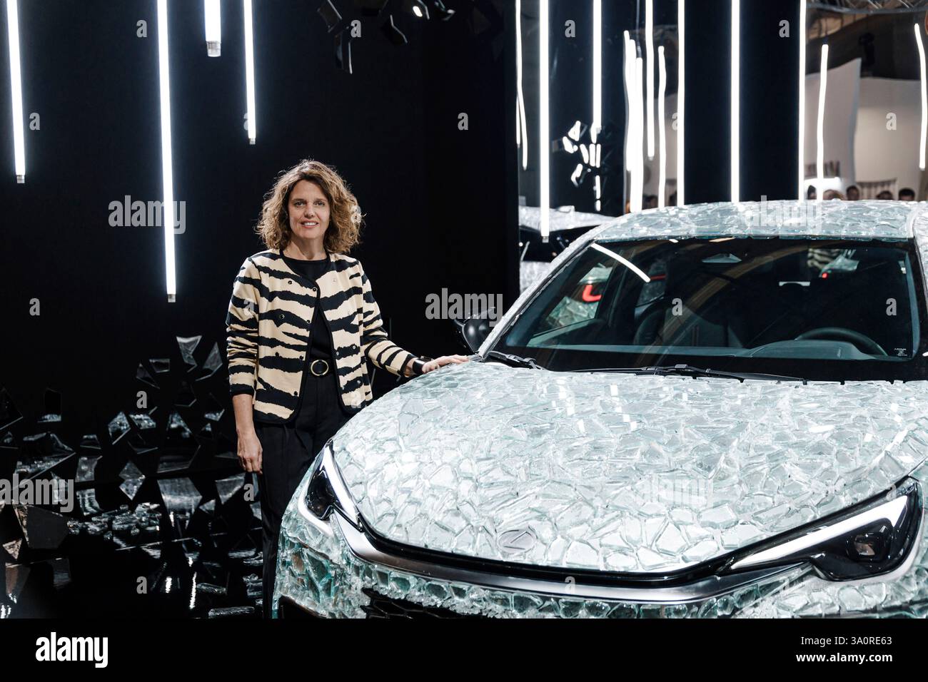 The director of Lexus Spain, Mar Pieltain, poses with the Lexus LBX ...
