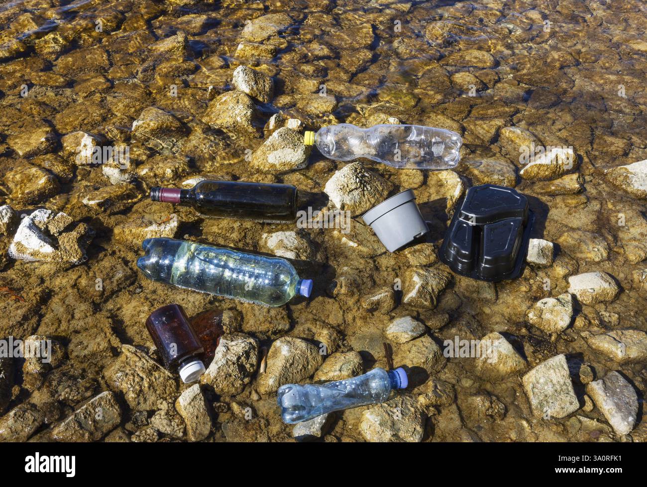 Environmental pollution, Household waste washed up on the lake shore ...