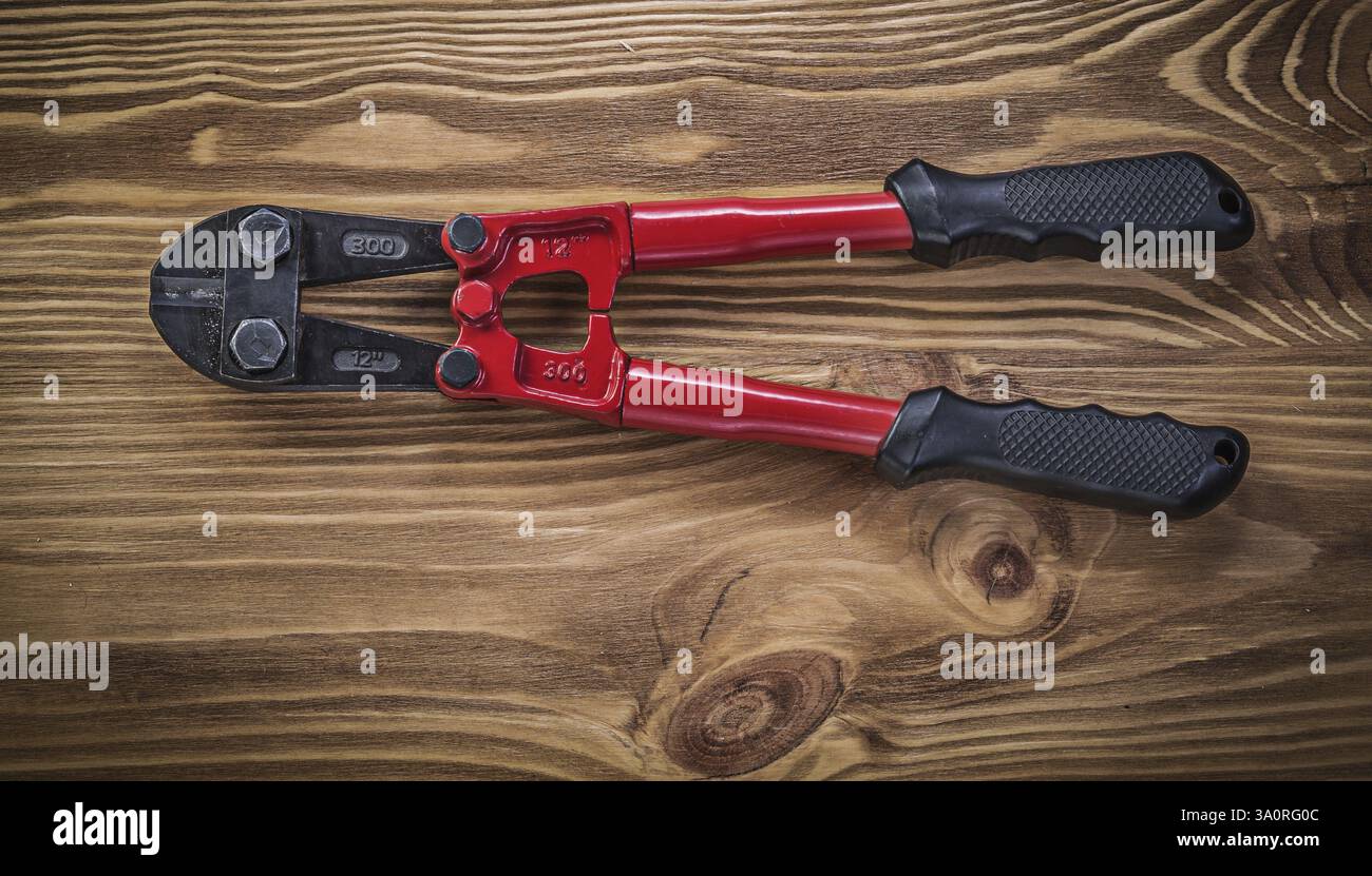 Bolt cutter on vintage wooden board construction concept Stock Photo ...