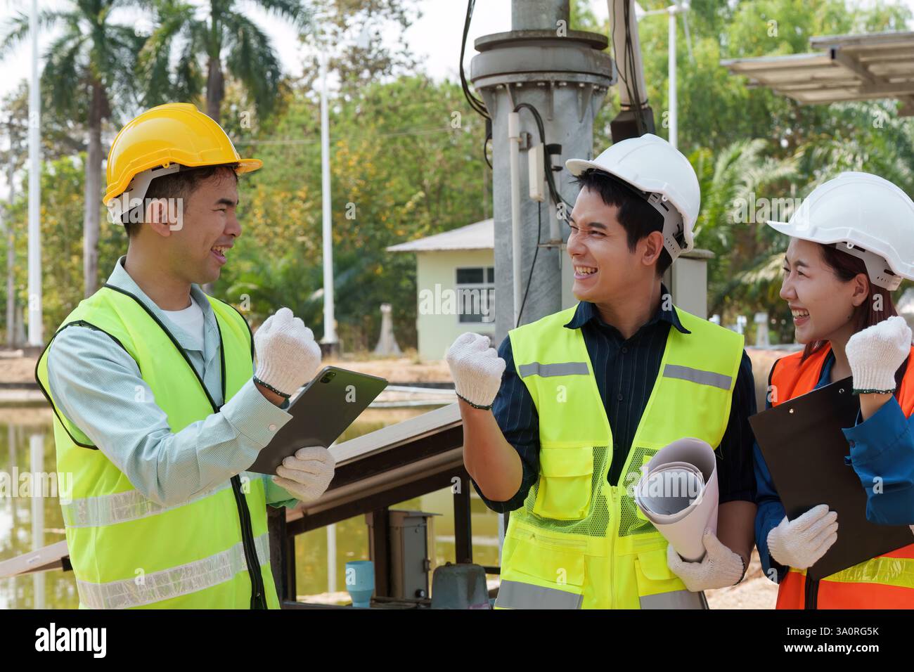 Team Collaboration. Diverse construction team celebrating after a ...
