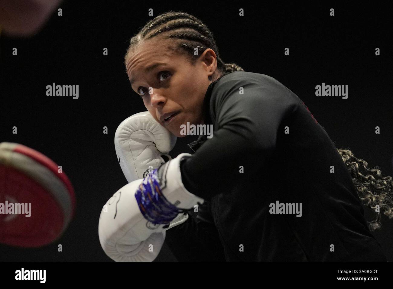 British boxer Natasha Jonas attends a boxing media workout in London ...