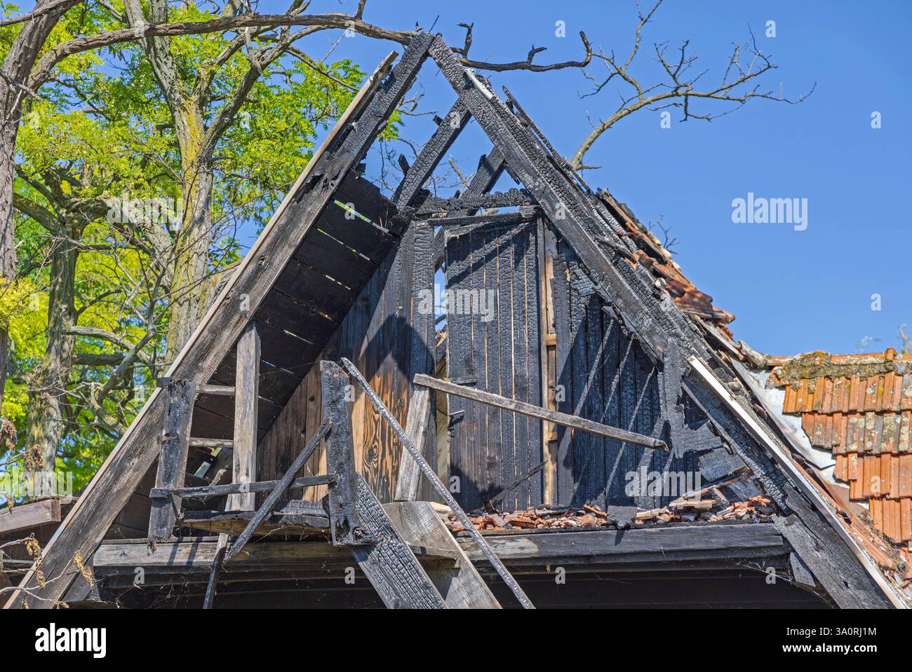 Burnt Attic Structure Fire Damage at Small Cabin House Stock Photo - Alamy