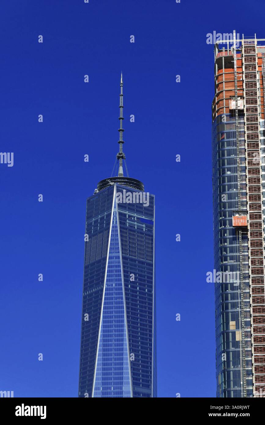 Freedom Tower Manhattan, Two modern skyscrapers under a clear blue sky ...