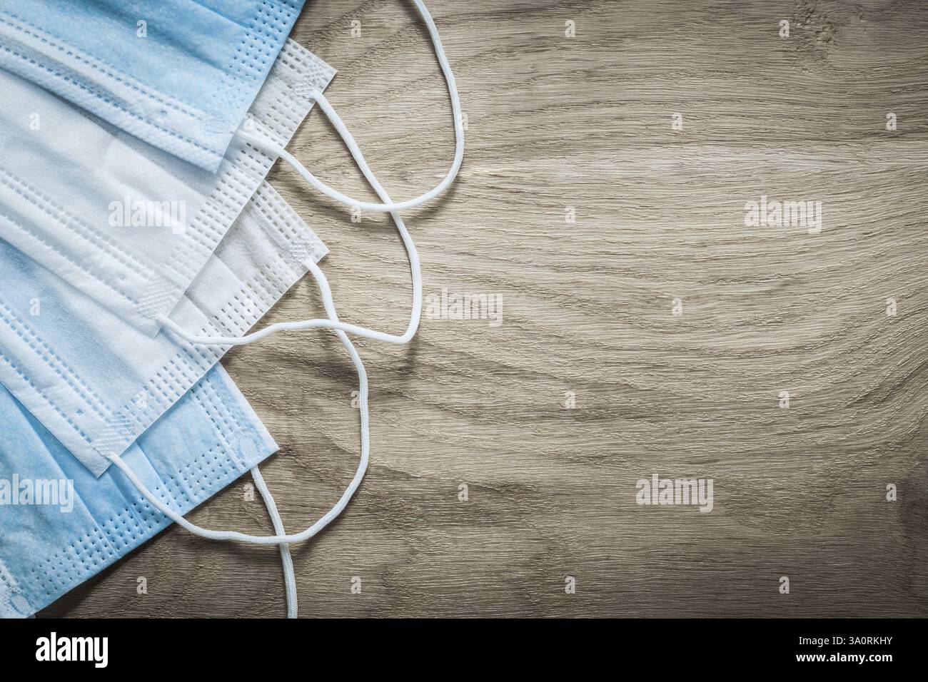 Composition of face sterile masks on wooden board Stock Photo - Alamy