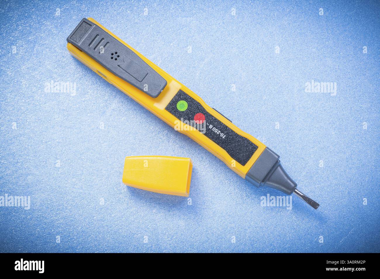 Electrical tester indicating device on blue background electricity ...