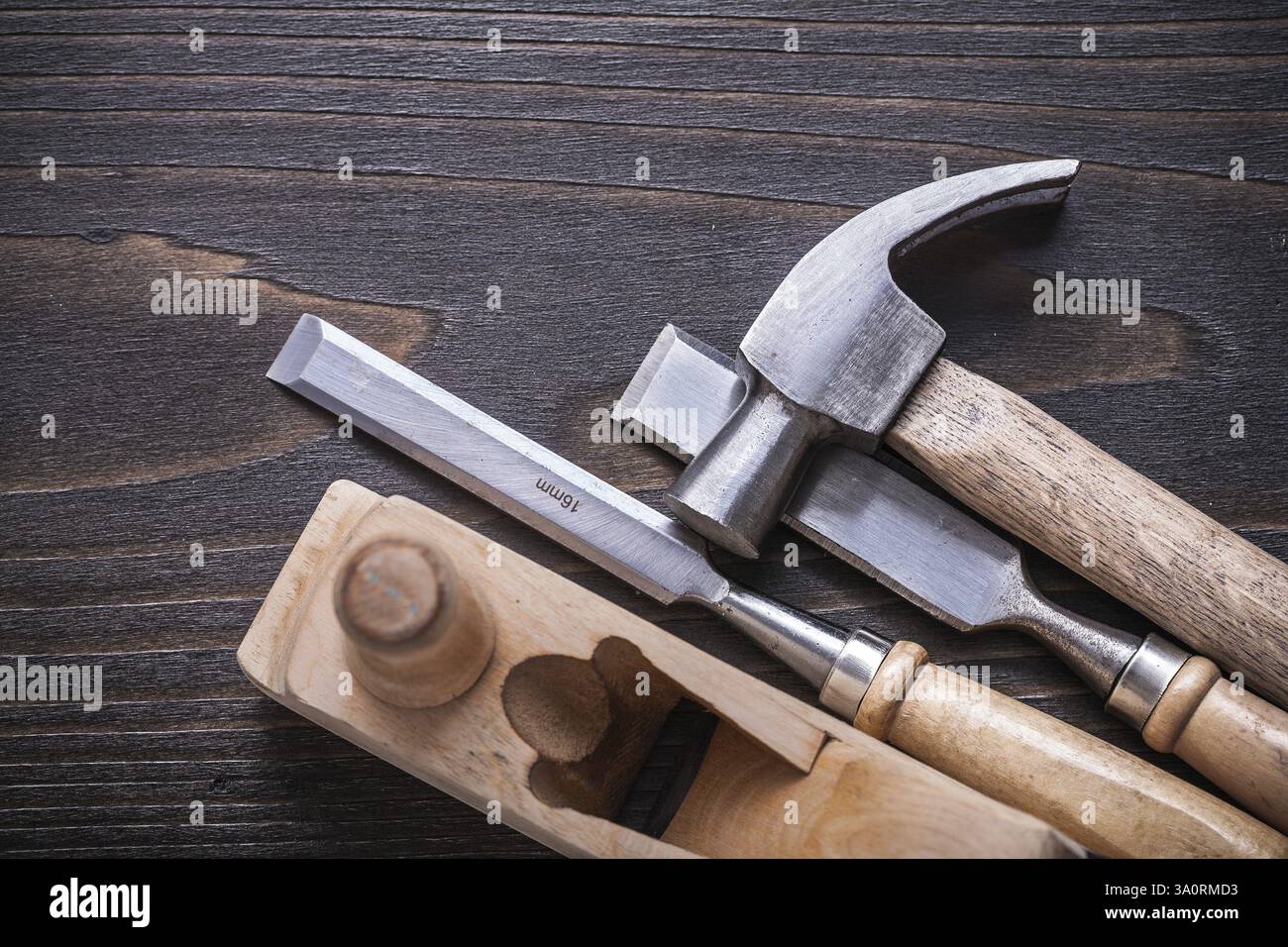 Claw hammer planer and firmer chisels on vintage wooden board ...