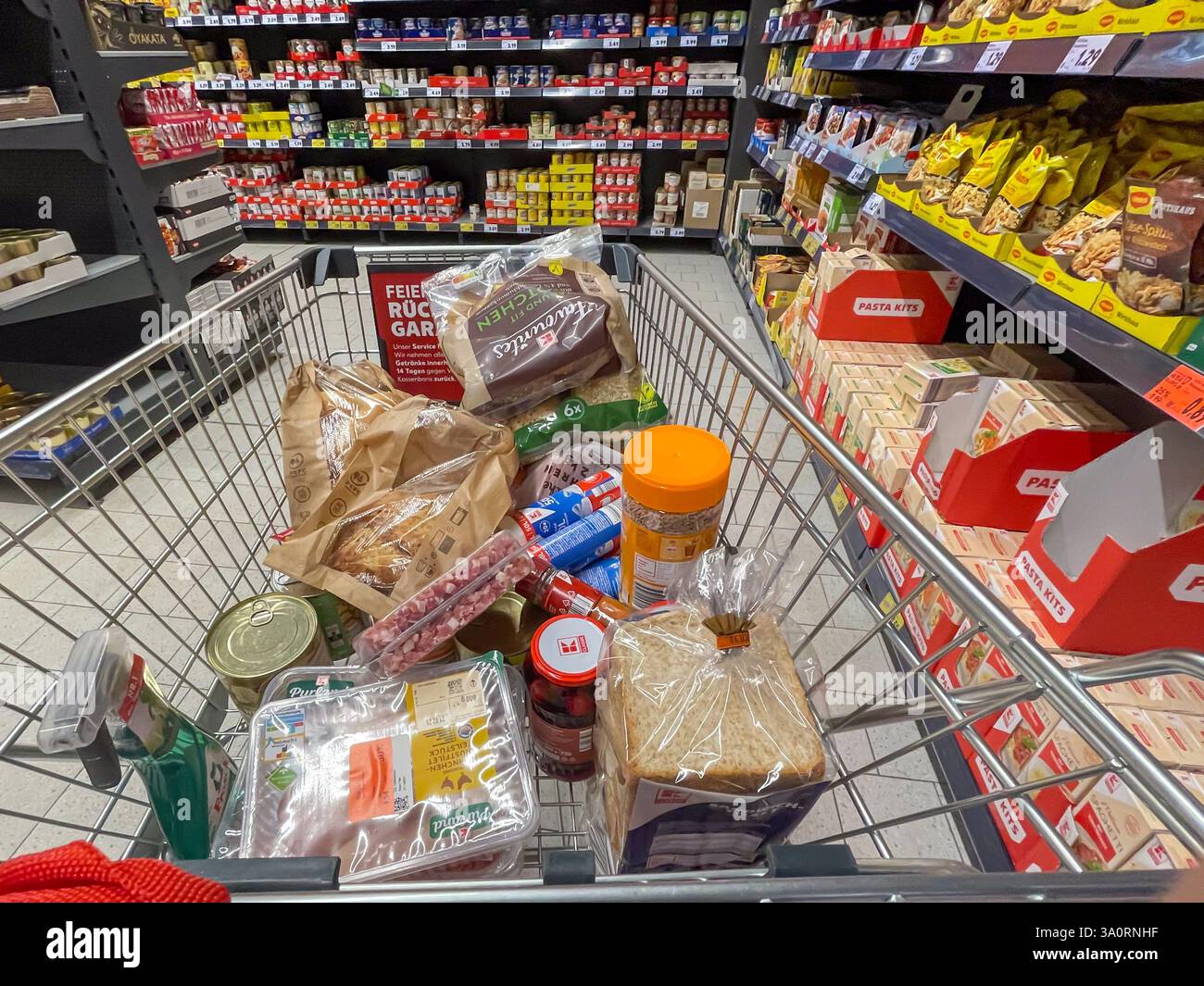 Germany Berlin February 19, 2025 A shopping cart full of groceries ...