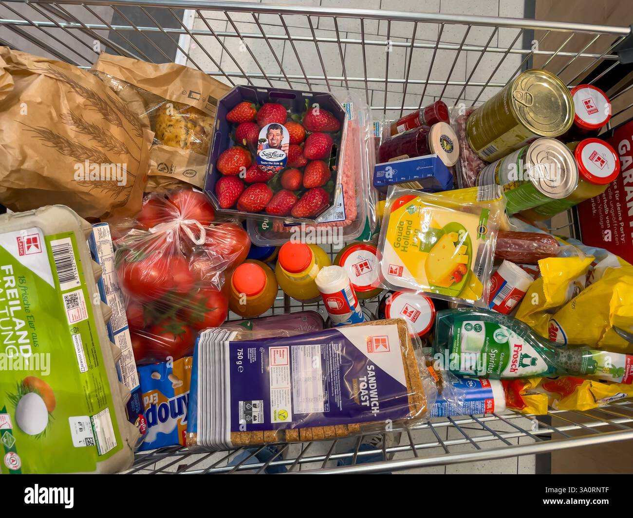 Germany Berlin February 19, 2025 A shopping cart full of food items ...